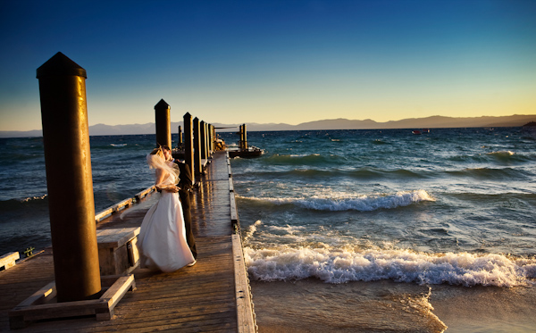 bride and groom on pier at waterfront wedding photo by Catherine Hall ...