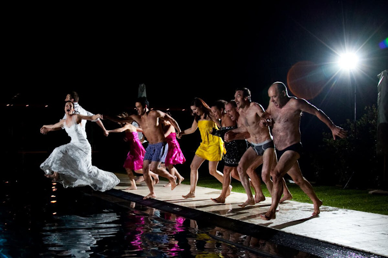 Bride leading a group jump into the pool -photo by South Africa based ...