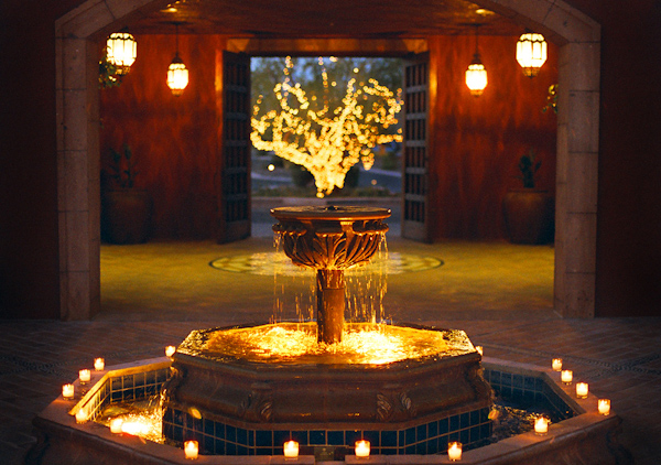 Gold lit fountain with candles - wedding photo by Harrison Hurwitz ...